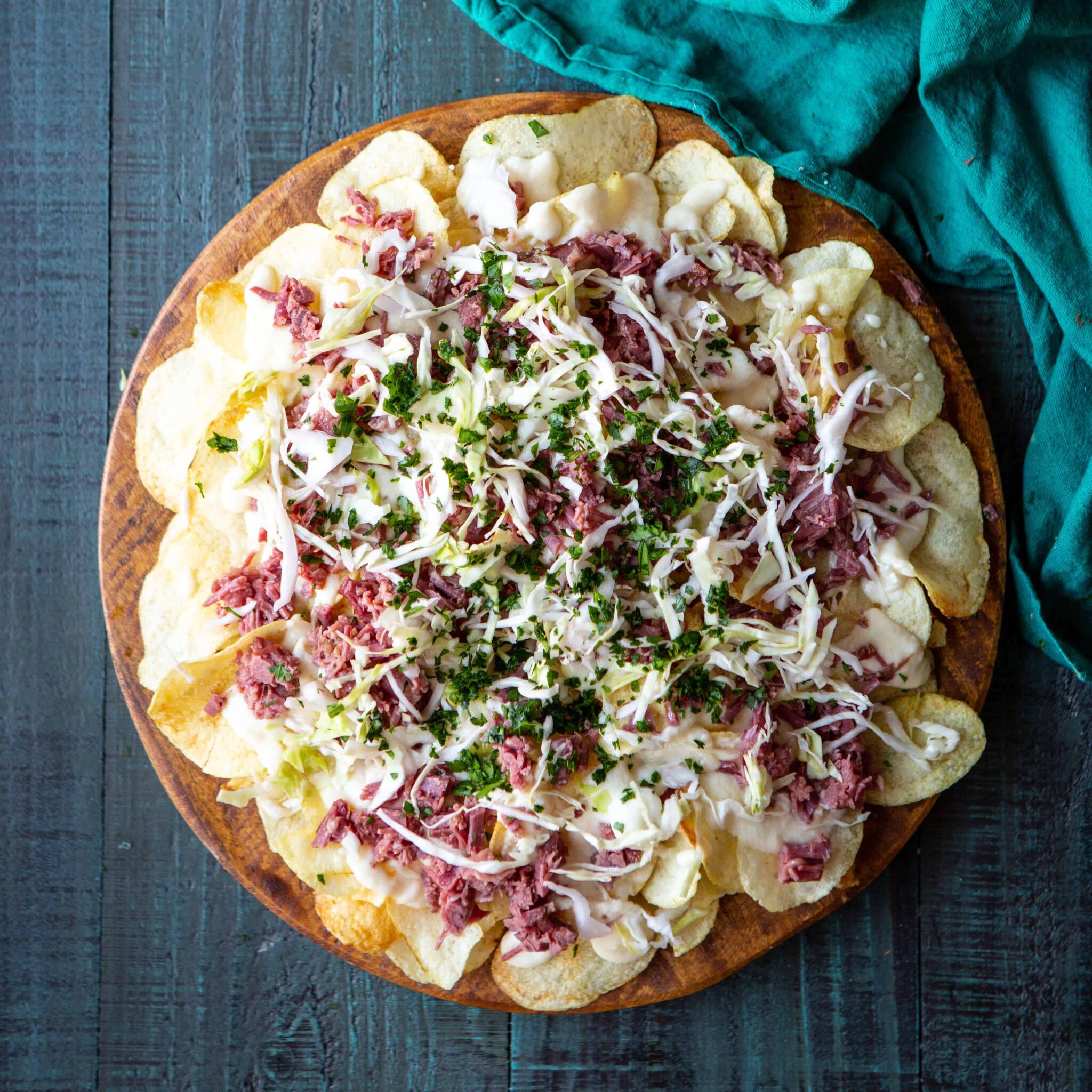 Corned Beef Nachos with Swiss Cheese Queso and Pickled Cabbage